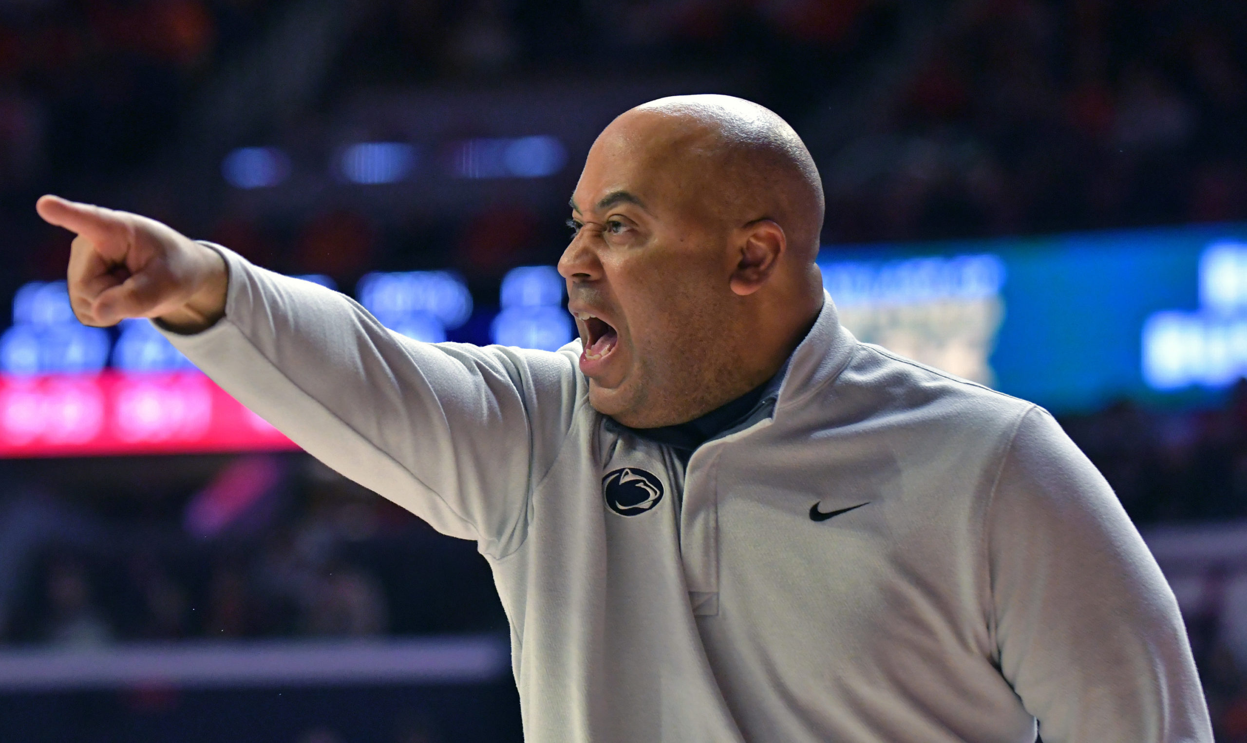 Penn State basketball coach tries his hand at football in video