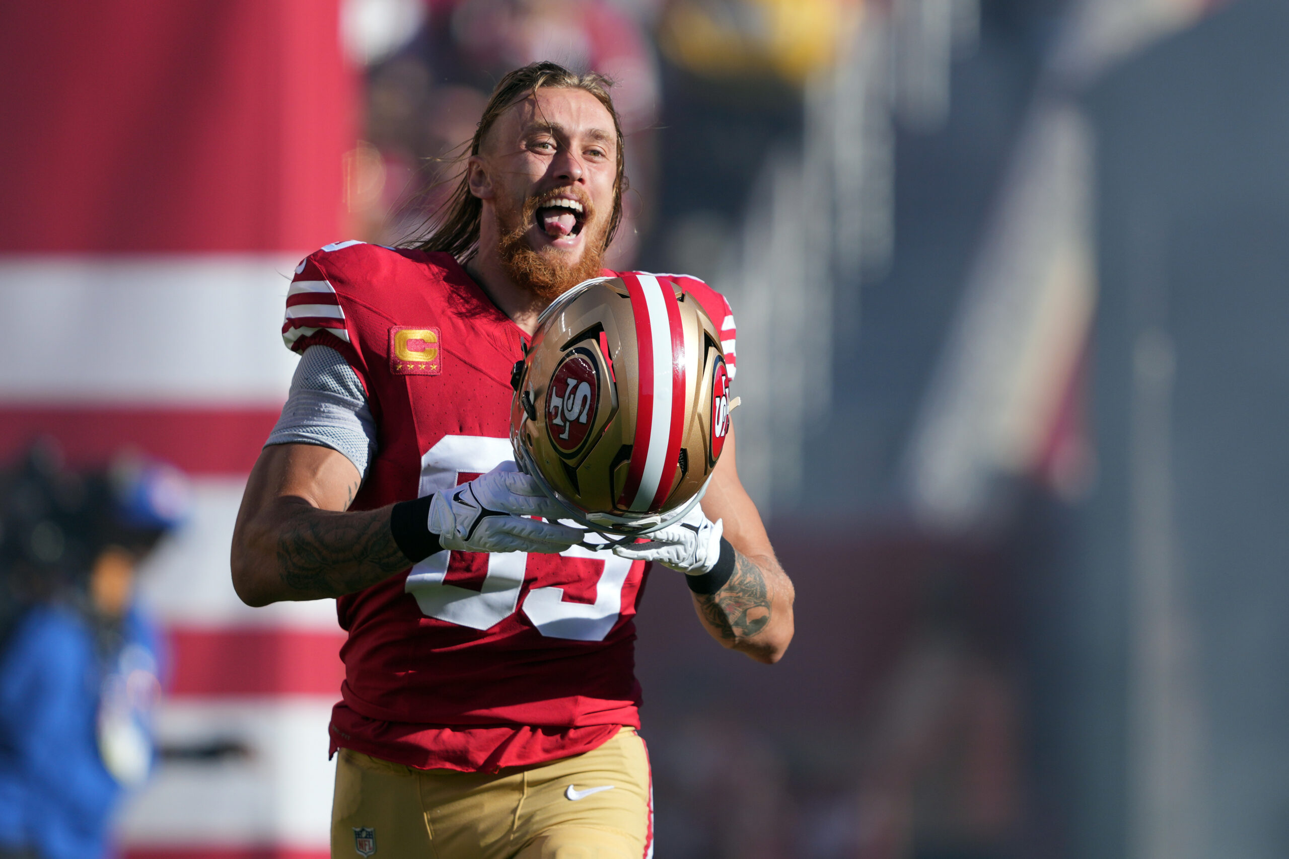 George Kittle pays up on Cy-Hawk bet with 49ers teammate Brock Purdy